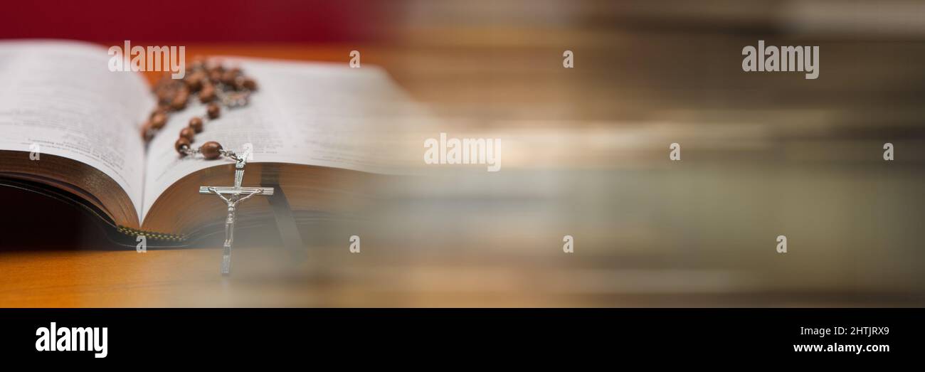 Close up view of rosary on open holy bible with copy space Stock Photo ...