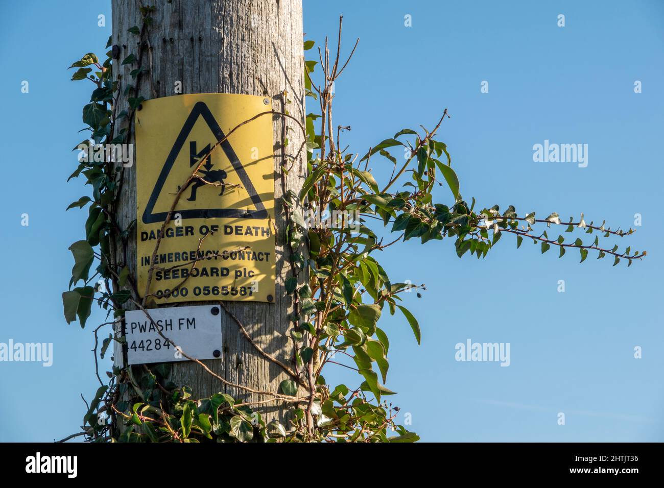 Danger of Death warning sign mounted on a wooden pole Stock Photo - Alamy