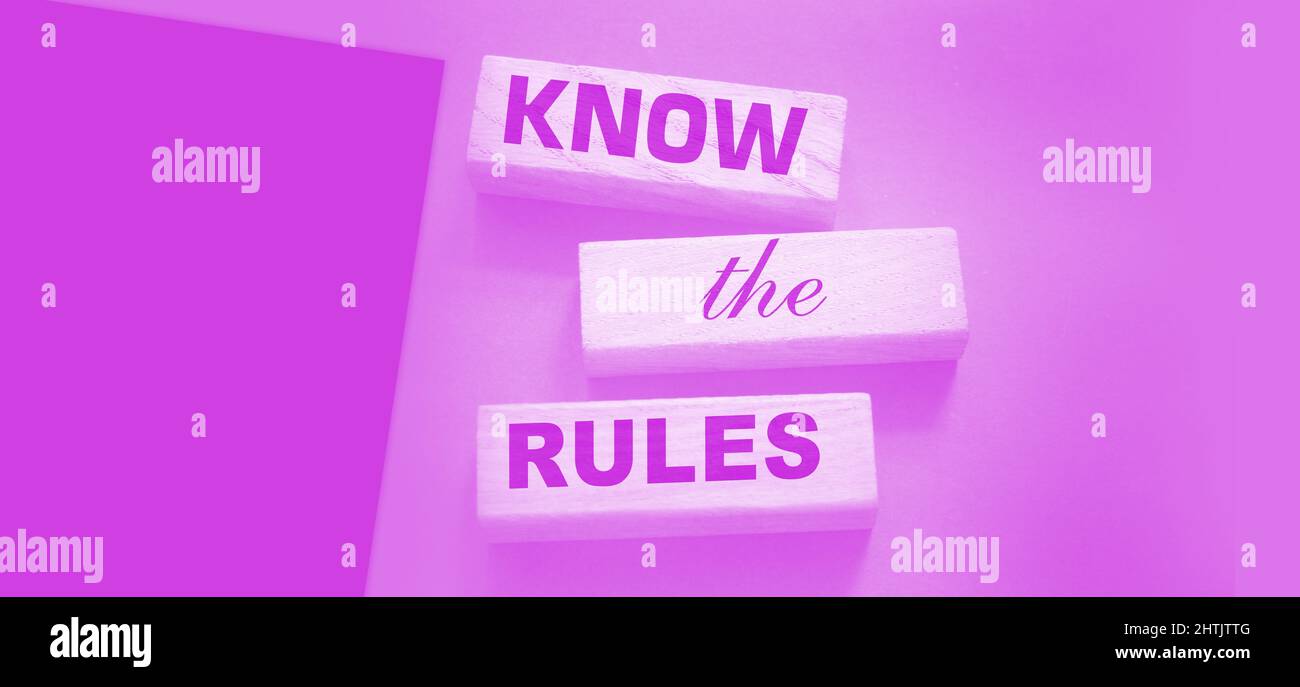 Know the rules word on wooden blocks isolated on dark grey background ...