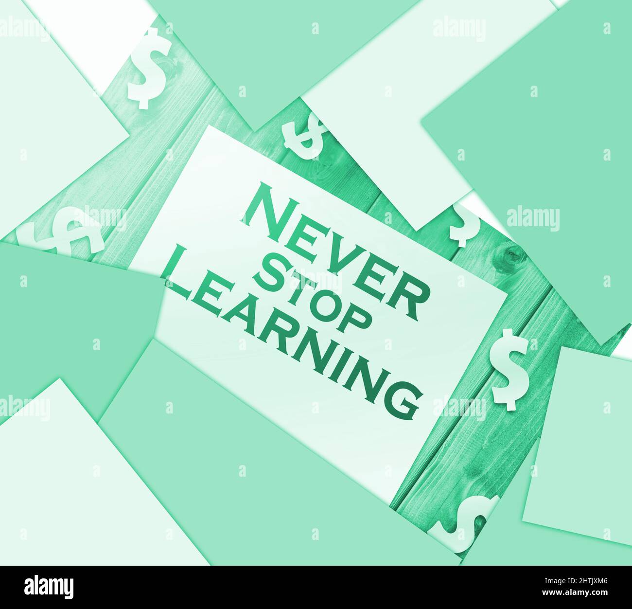 Text never stop learning on page and paper dollar signs around on ...