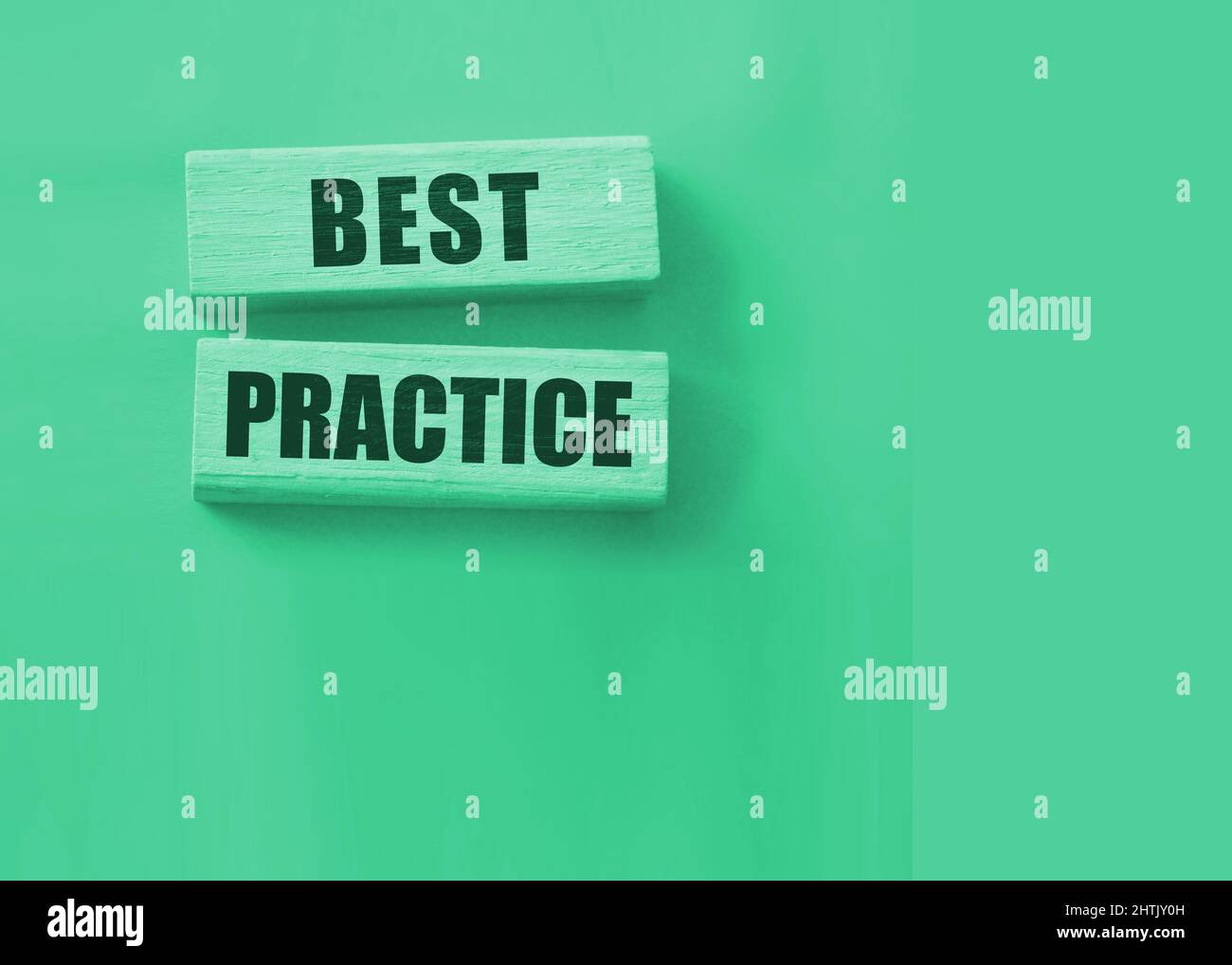 Best practice words in wooden blocks on red. Business or healthcare ...