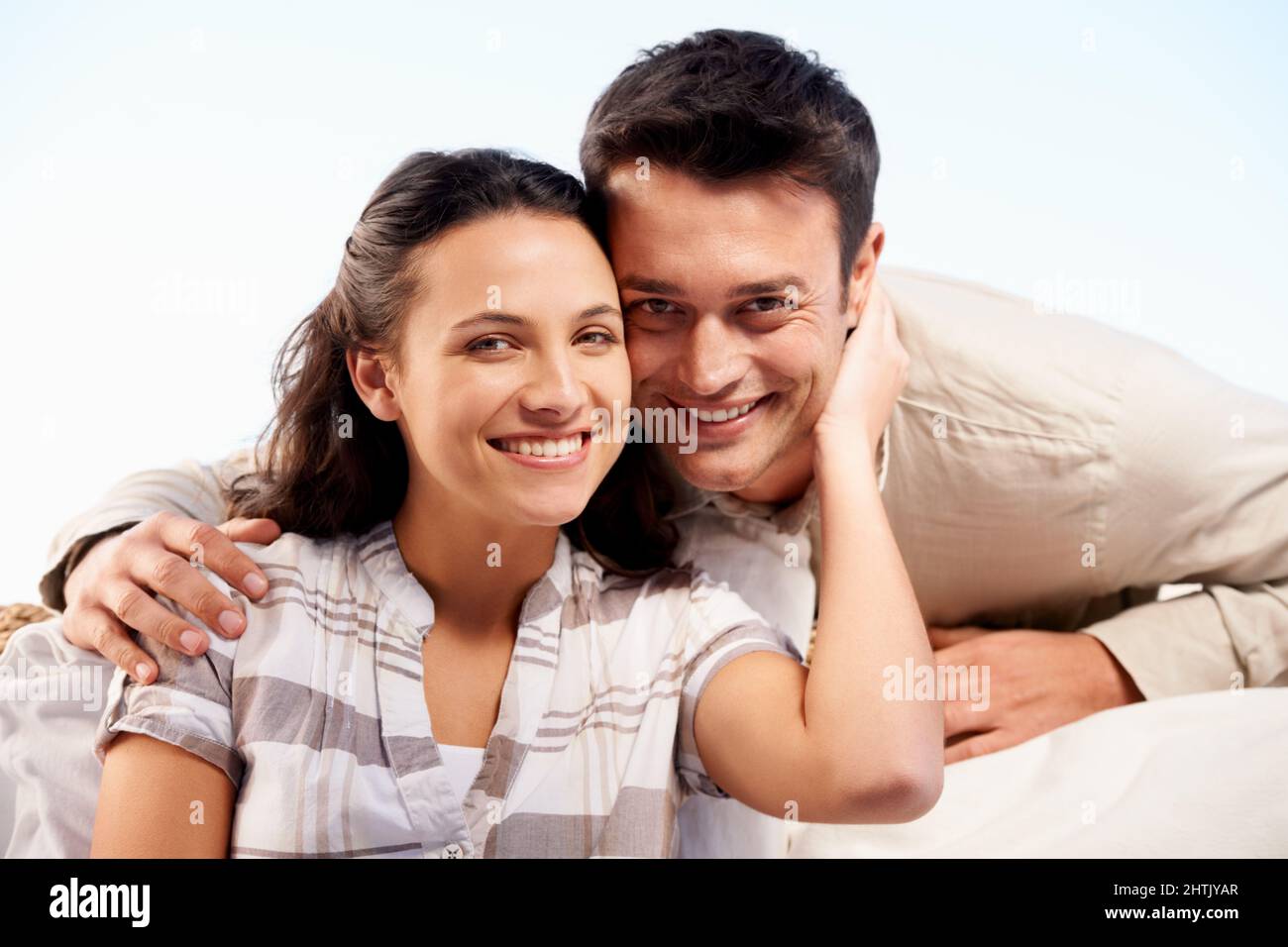 Perfect for each other. A cute couple smiling together Stock Photo - Alamy