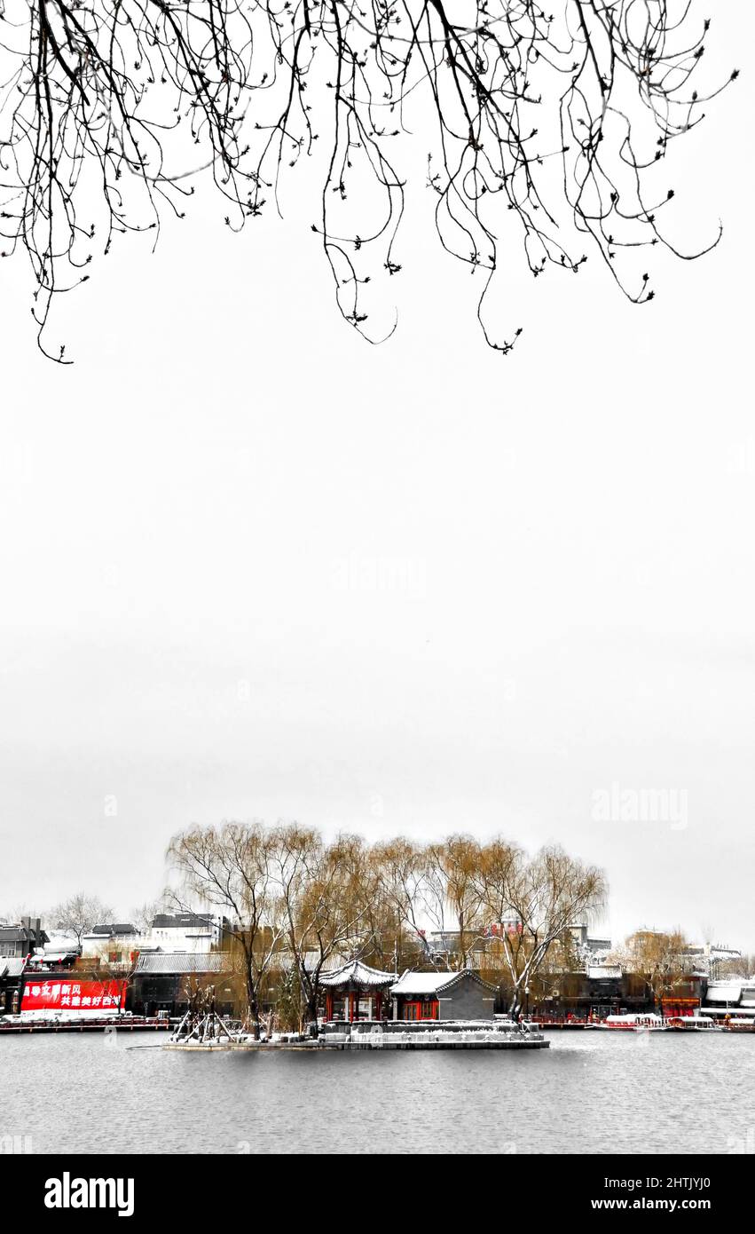 Vertical shot of the lake Houhai and the architecture in winter, China ...