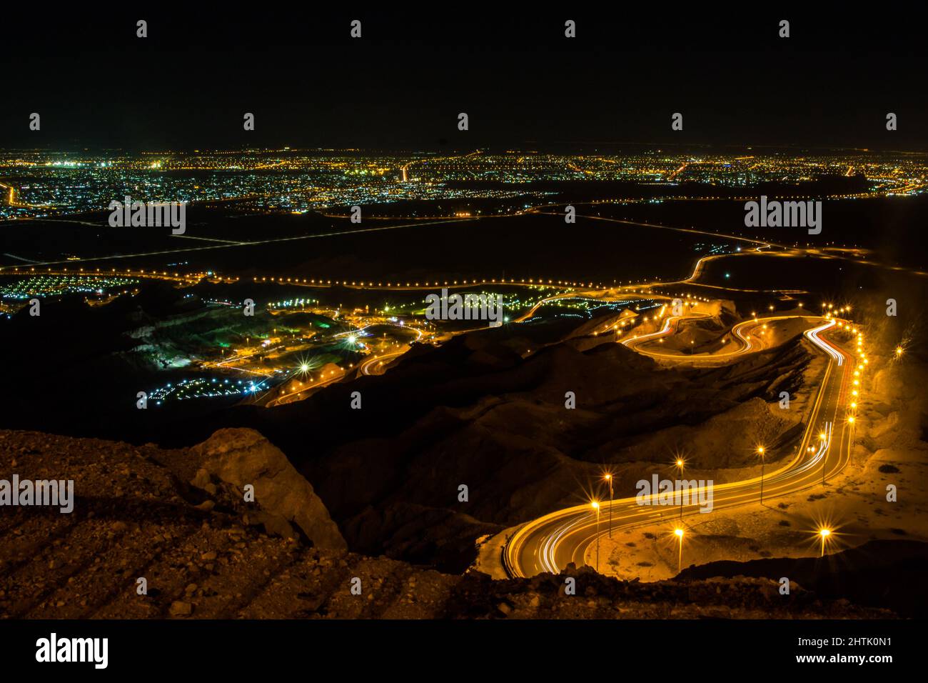 View of Al Ain city at night from Jabal Hafeet Mountain with lights ...