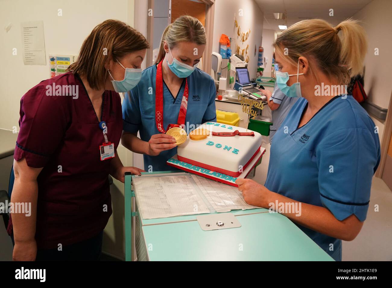 Olympic gold medal winning curler Vicky Wright shows off her medal to ...