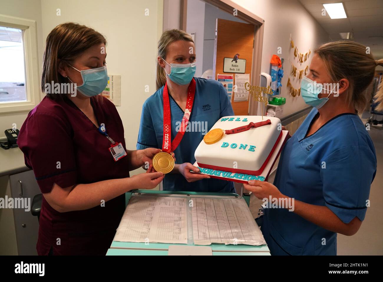 Olympic gold medal winning curler Vicky Wright shows off her medal to ...