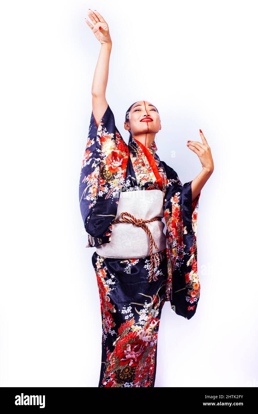 young pretty geisha in black kimono posing isolated on white background ...