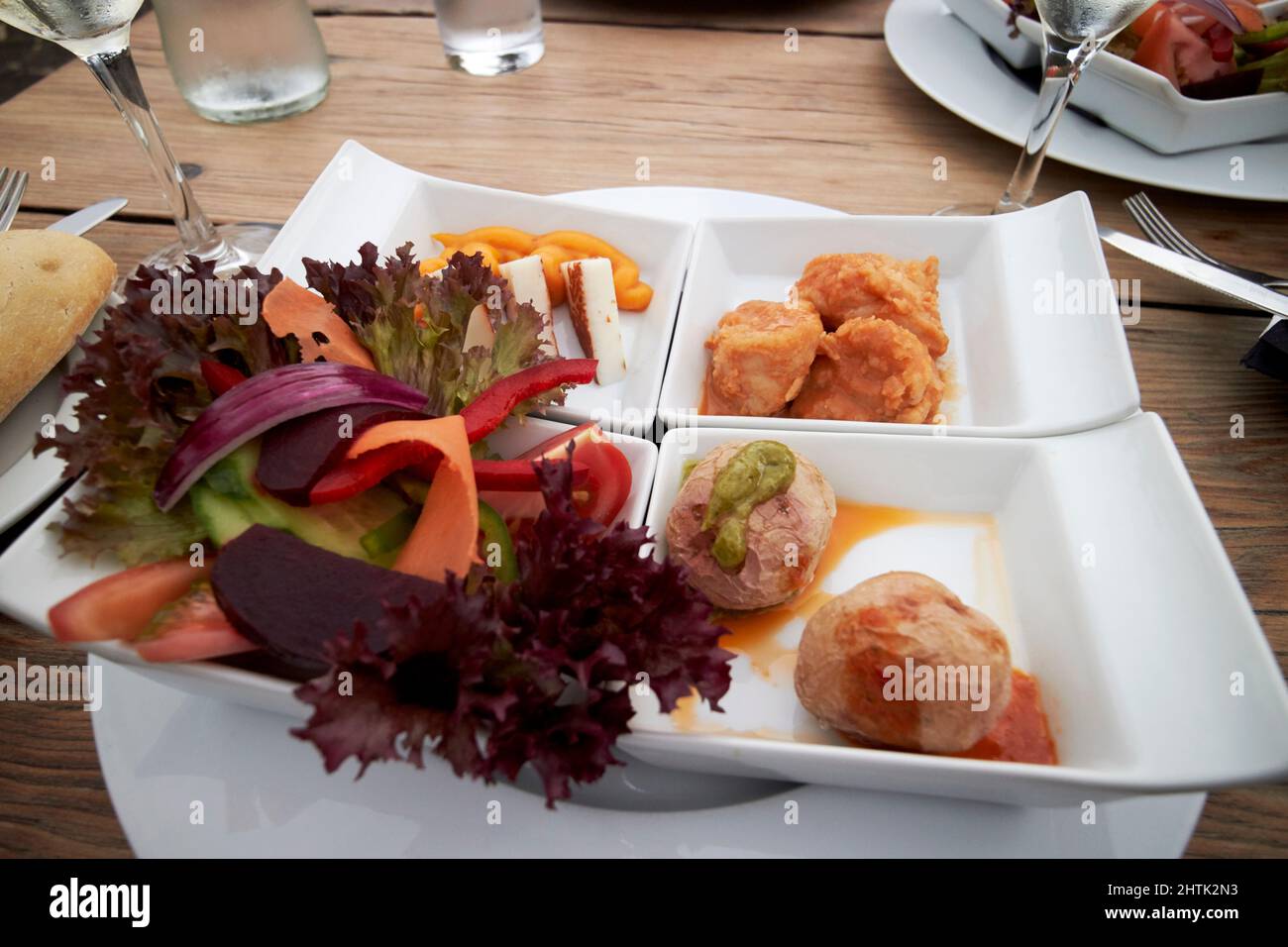 typical canarian food tapas of canarian potatoes, fried fish pieces ...