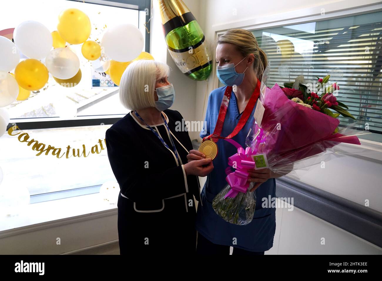 Olympic gold medal winning curler Vicky Wright is presented with ...