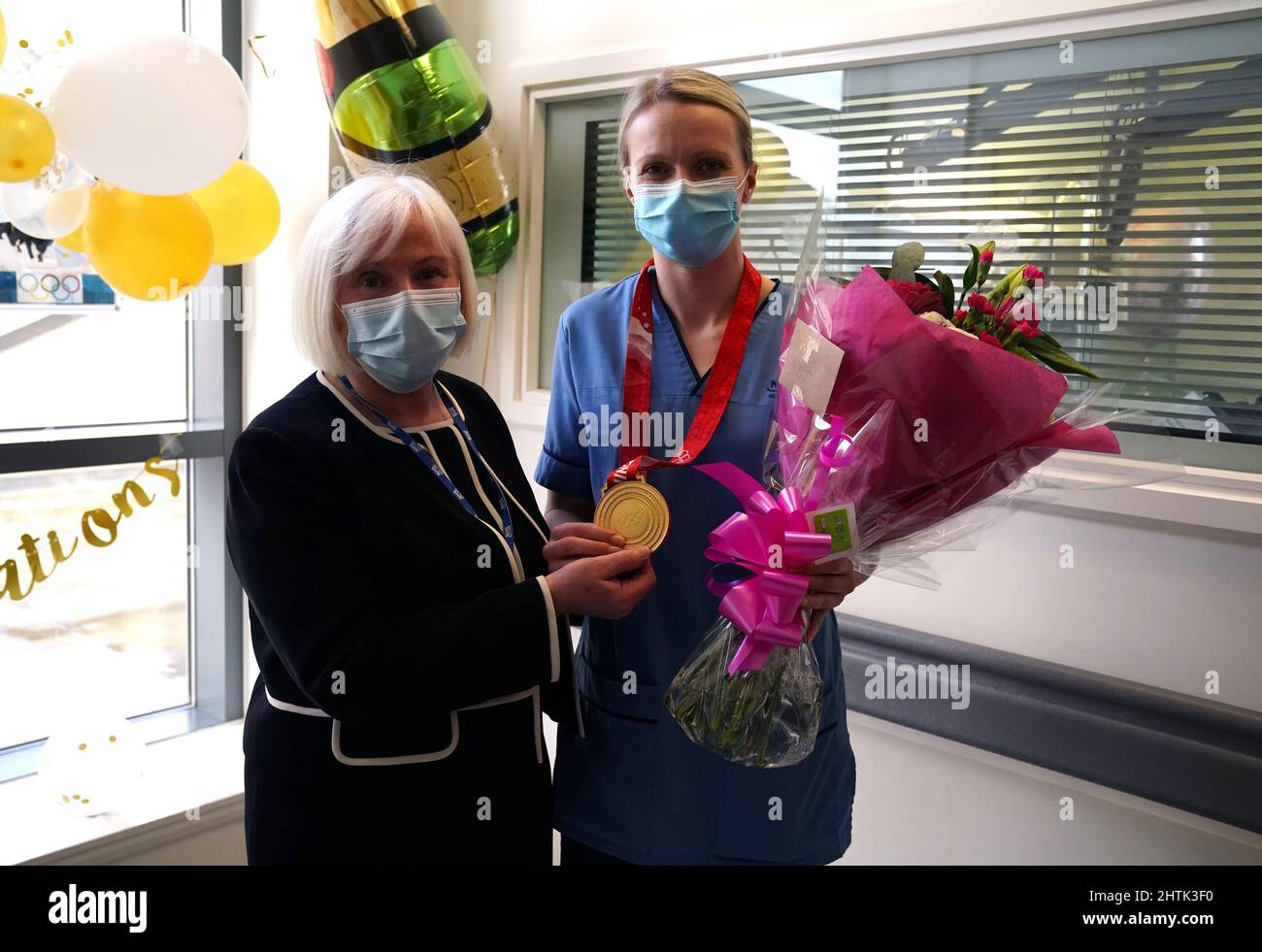 Olympic gold medal winning curler Vicky Wright is presented with ...