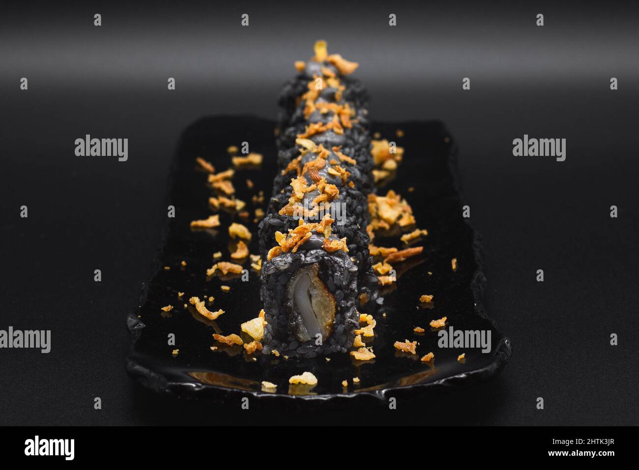 Brazilian fusion of japanese sushi roll with black rice ,ade with squid ...