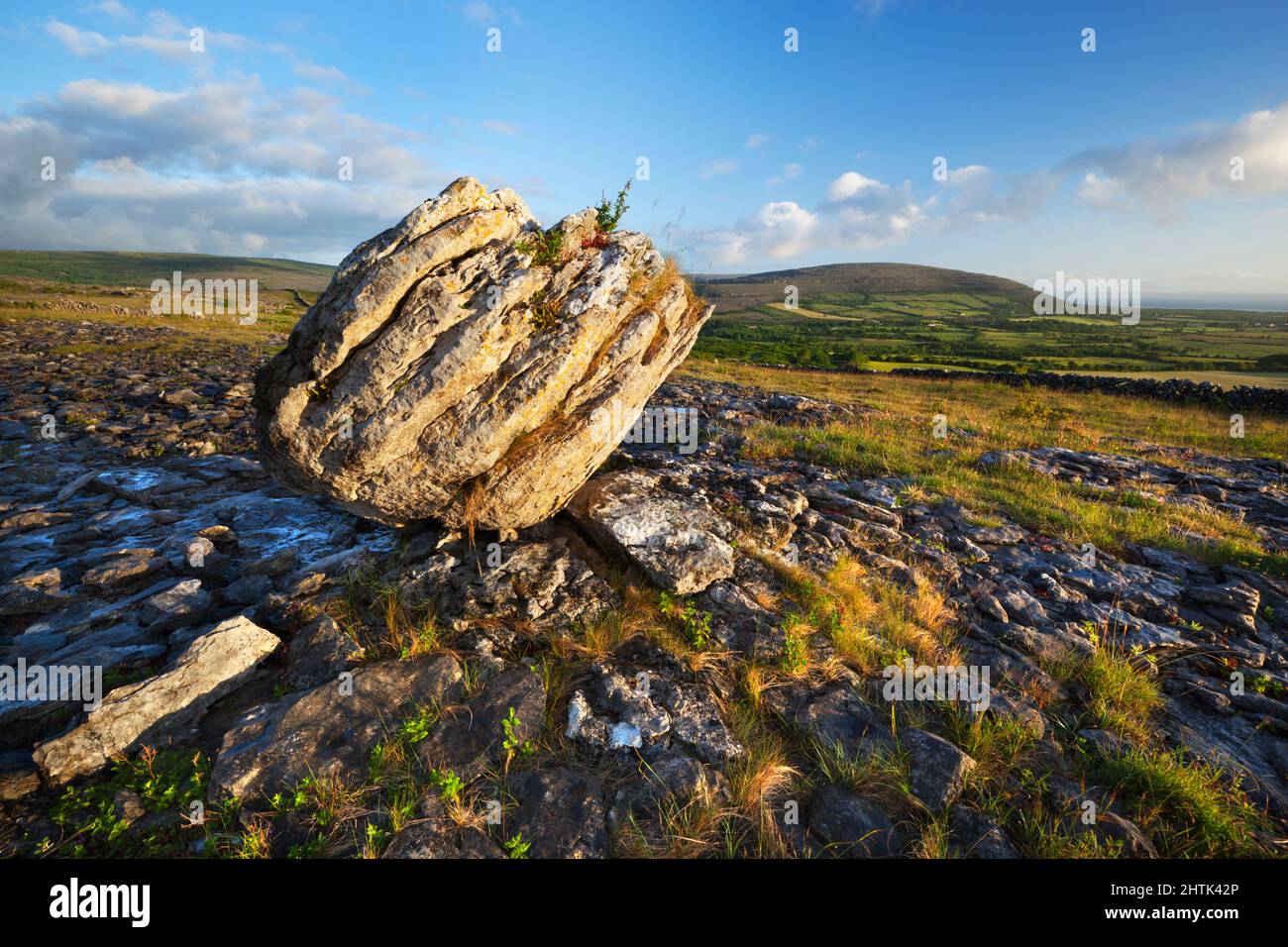 Typical landscape with fissured limestone pavement and round boulder ...
