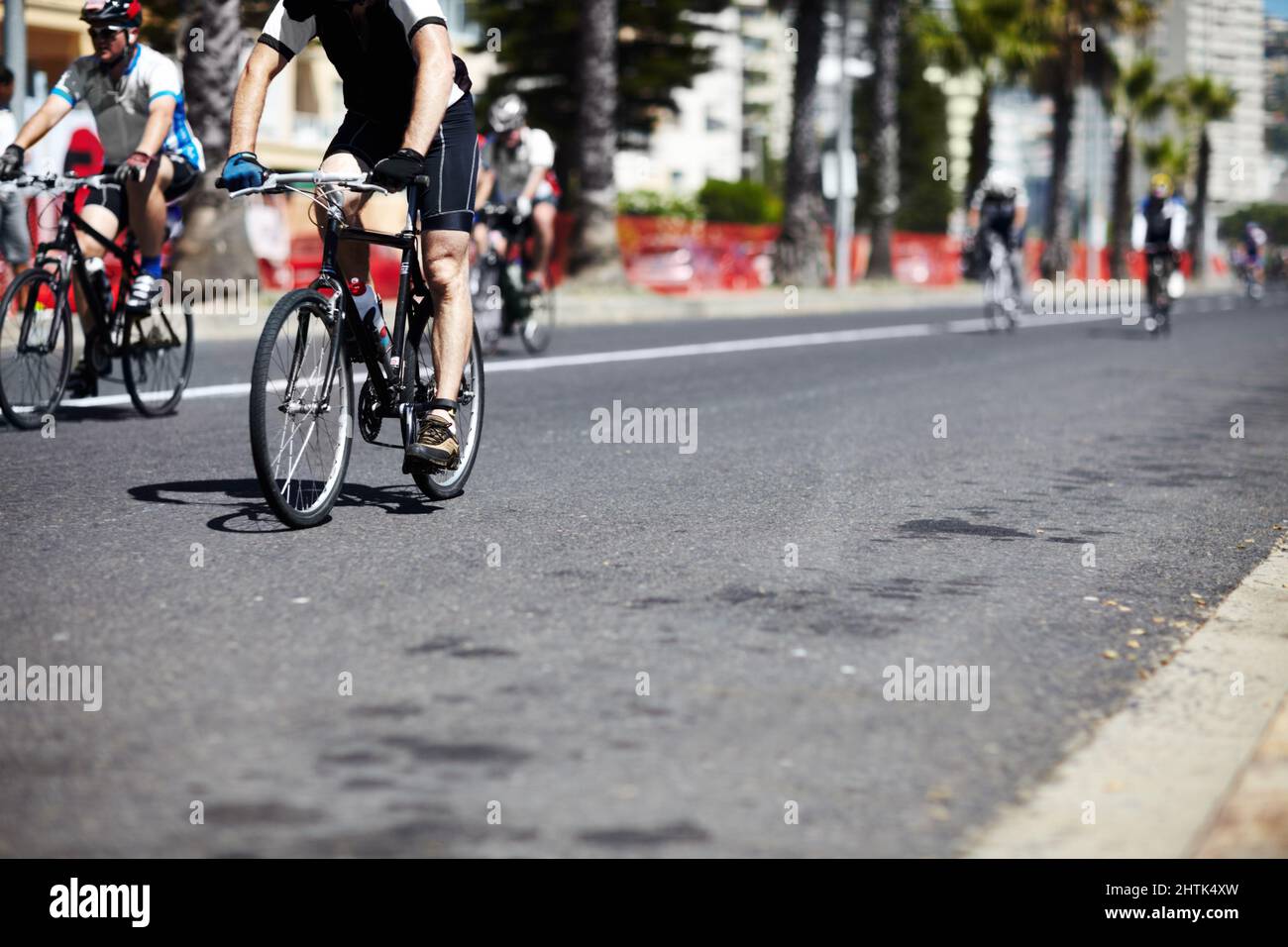 Aiming to win. A group of cyclers out on the road during a cycle tour ...