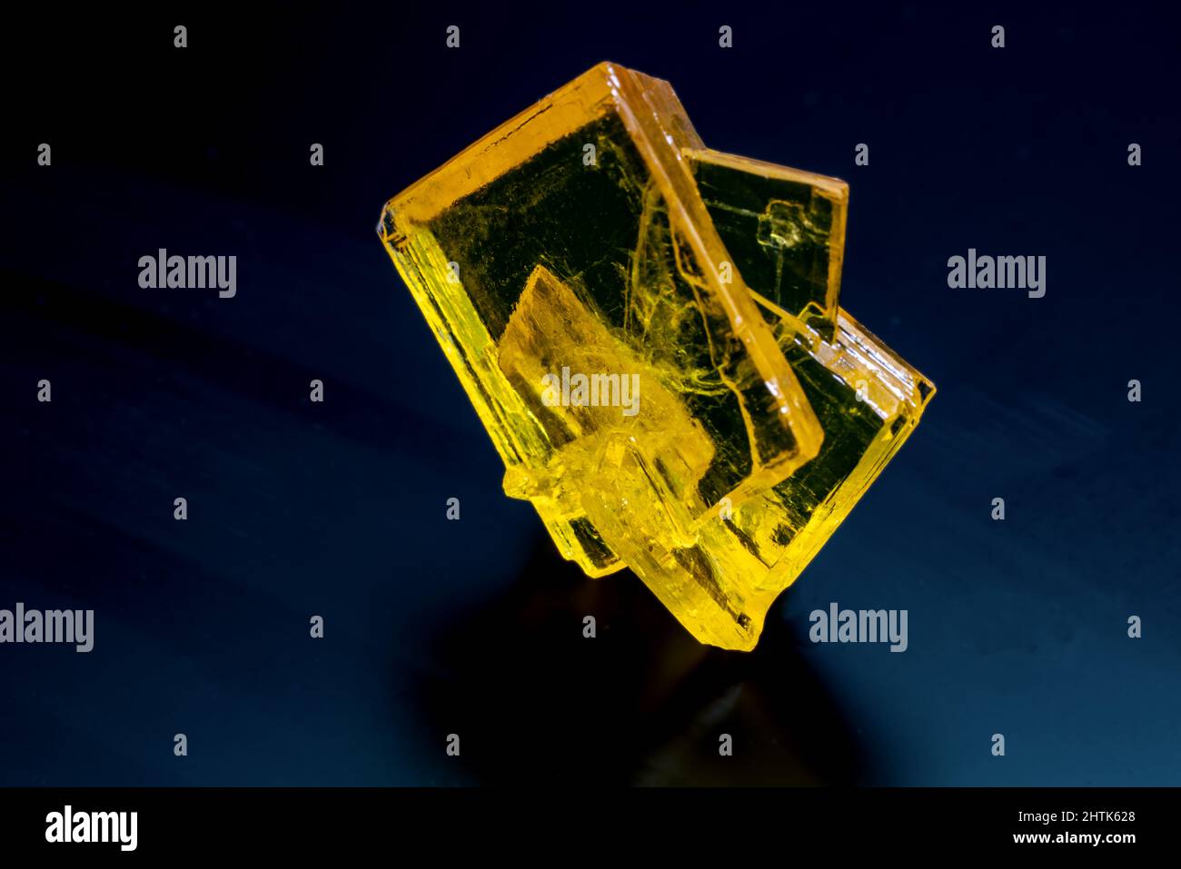 raw mineral crystal on black background. semi-precious yellow crystal ...