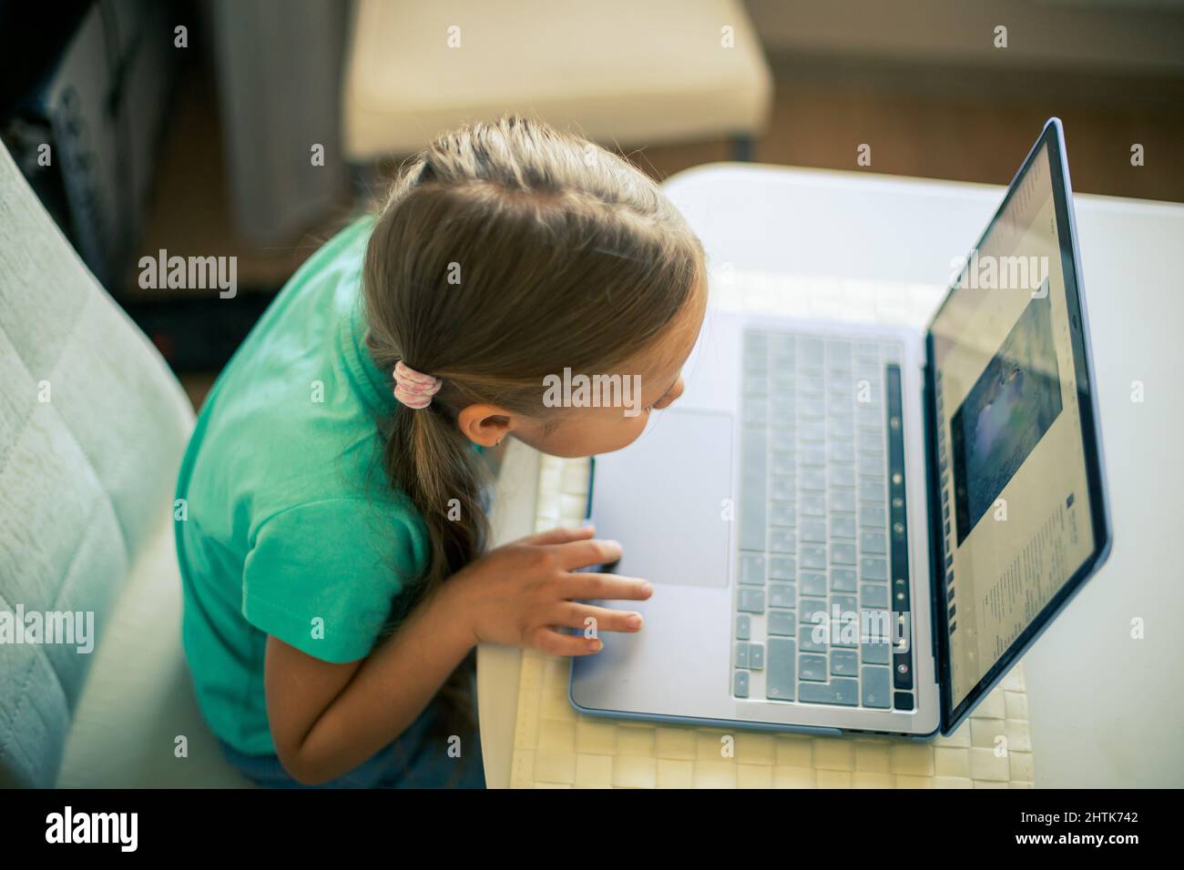 Little cute girl uses laptop to have video call Stock Photo - Alamy