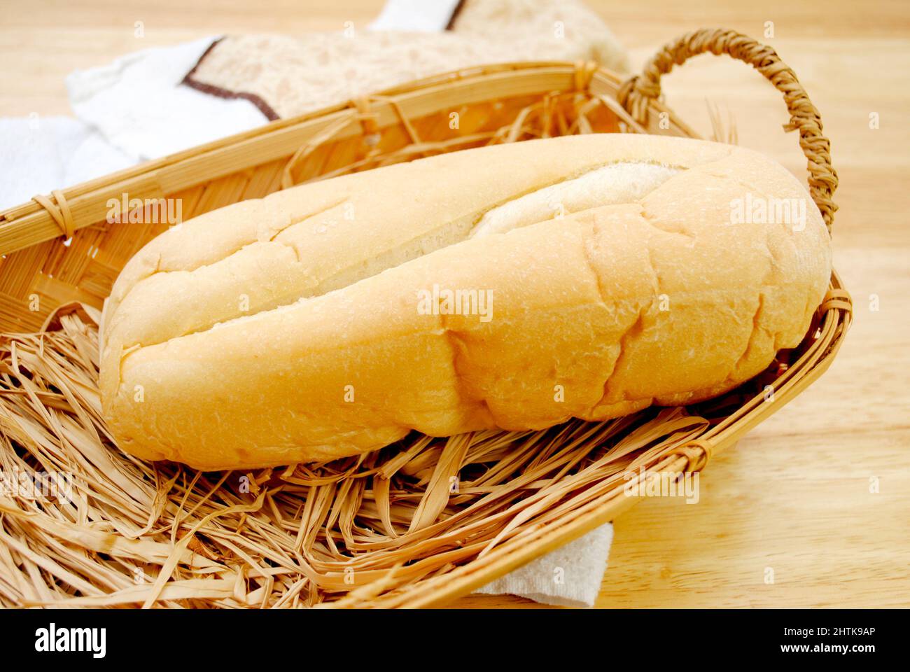A Single Loaf of Fresh Bread Left in a Rustic Breadbasket Stock Photo ...