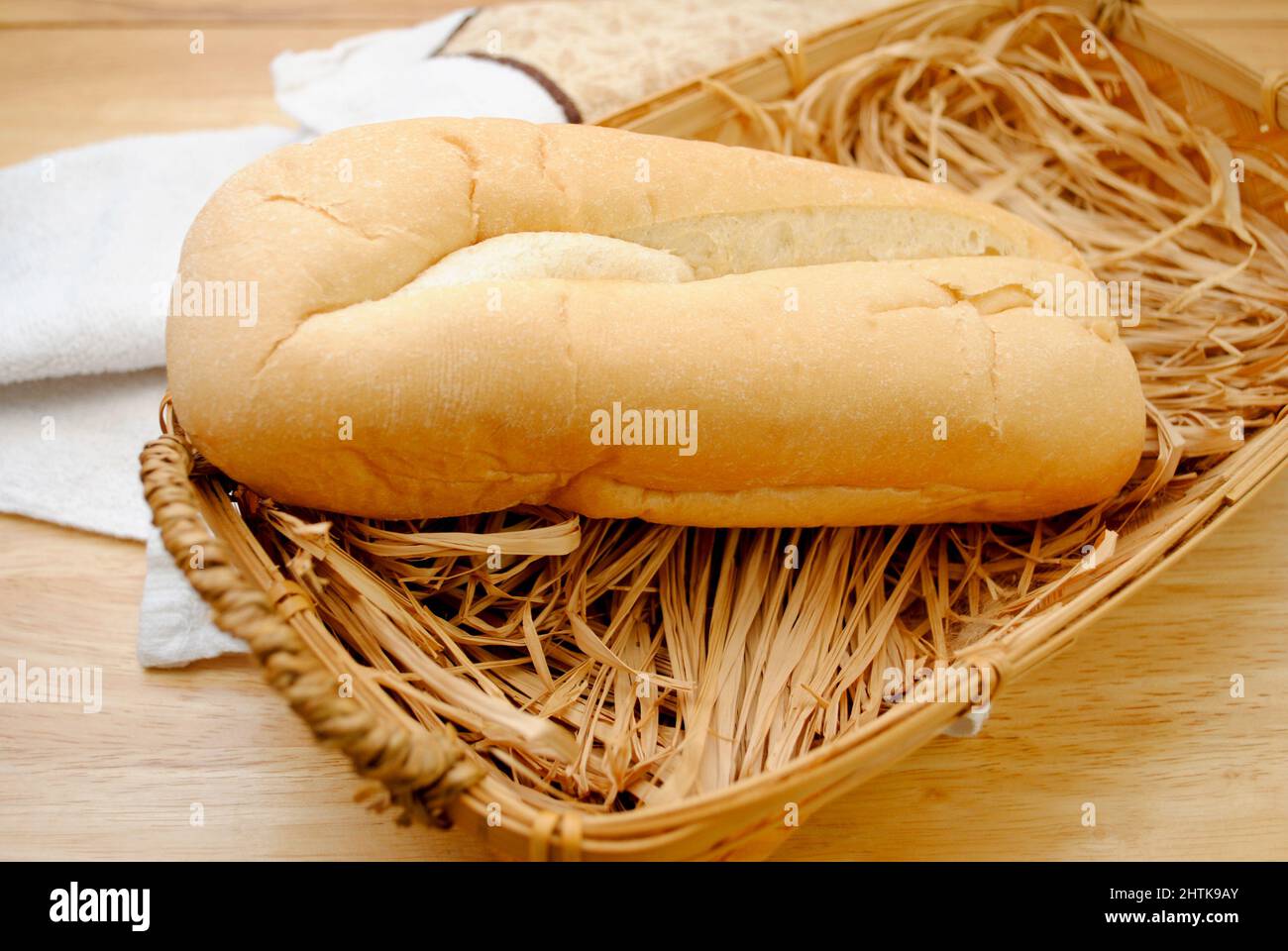 A Single Loaf of Fresh Bread Left in a Rustic Breadbasket Stock Photo ...