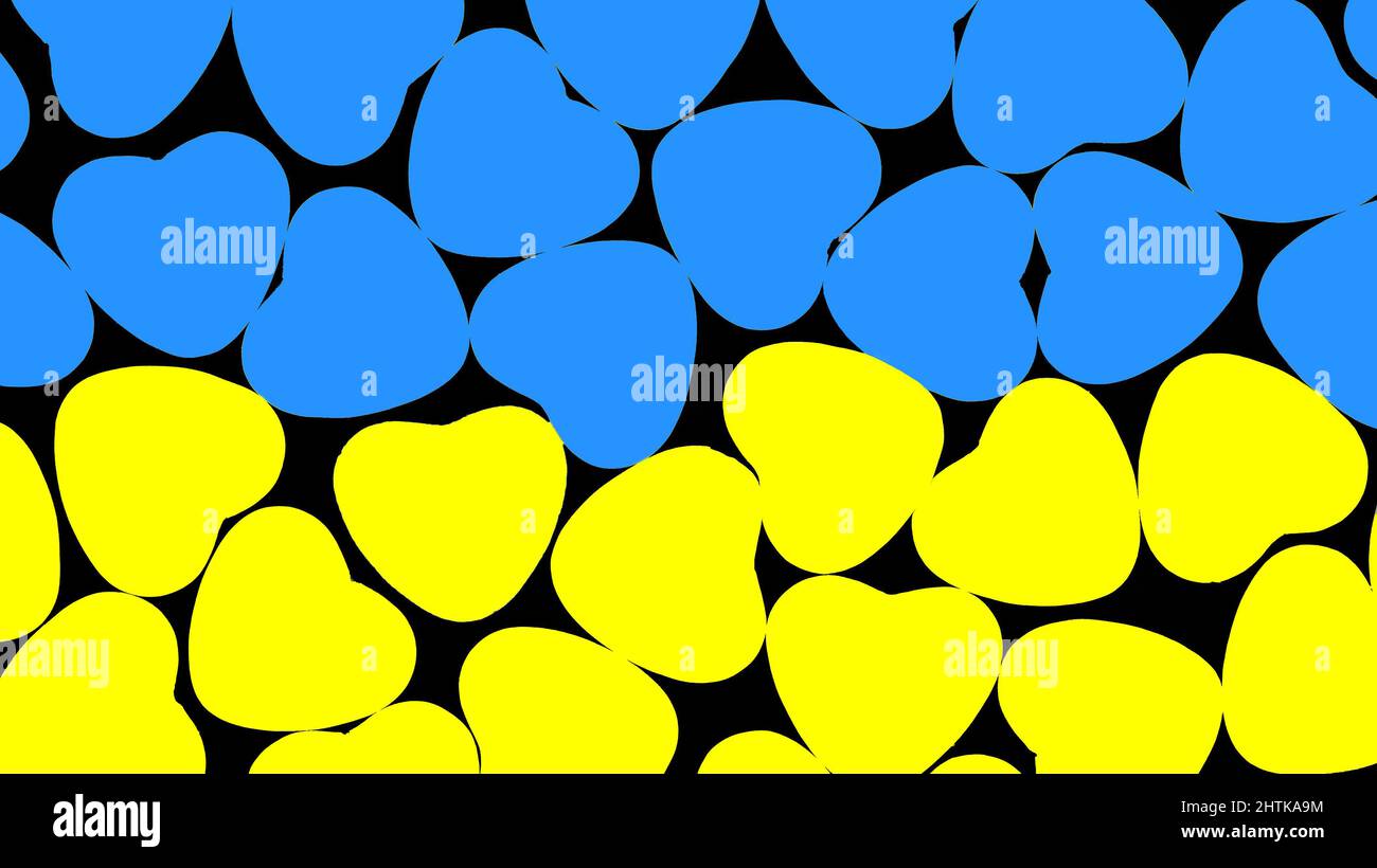 Yellow candy hearts with blue Ukrainian flag colors on black background ...