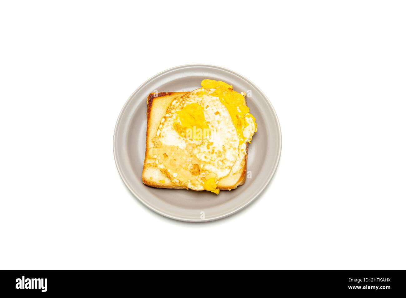 Toast made by pressing with white bread, breaking the yolk of a fried ...