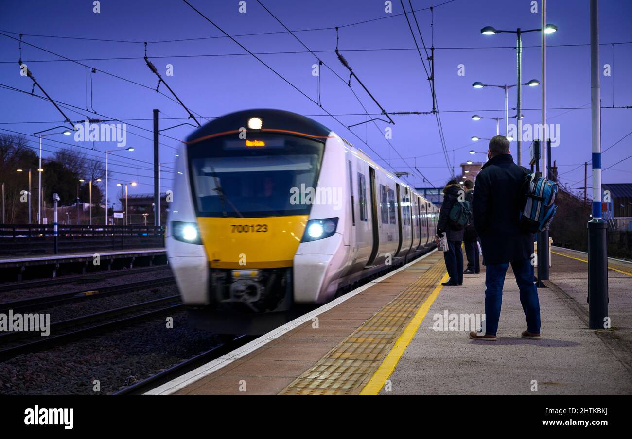 Thameslink class 700 train arriving at dusk at Huntingdon Railway ...