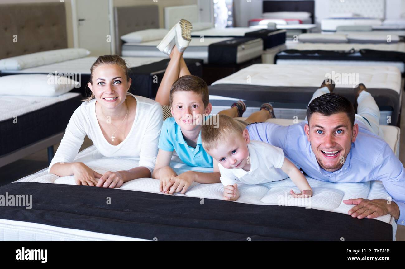 Customers are testing quality of mattress Stock Photo - Alamy