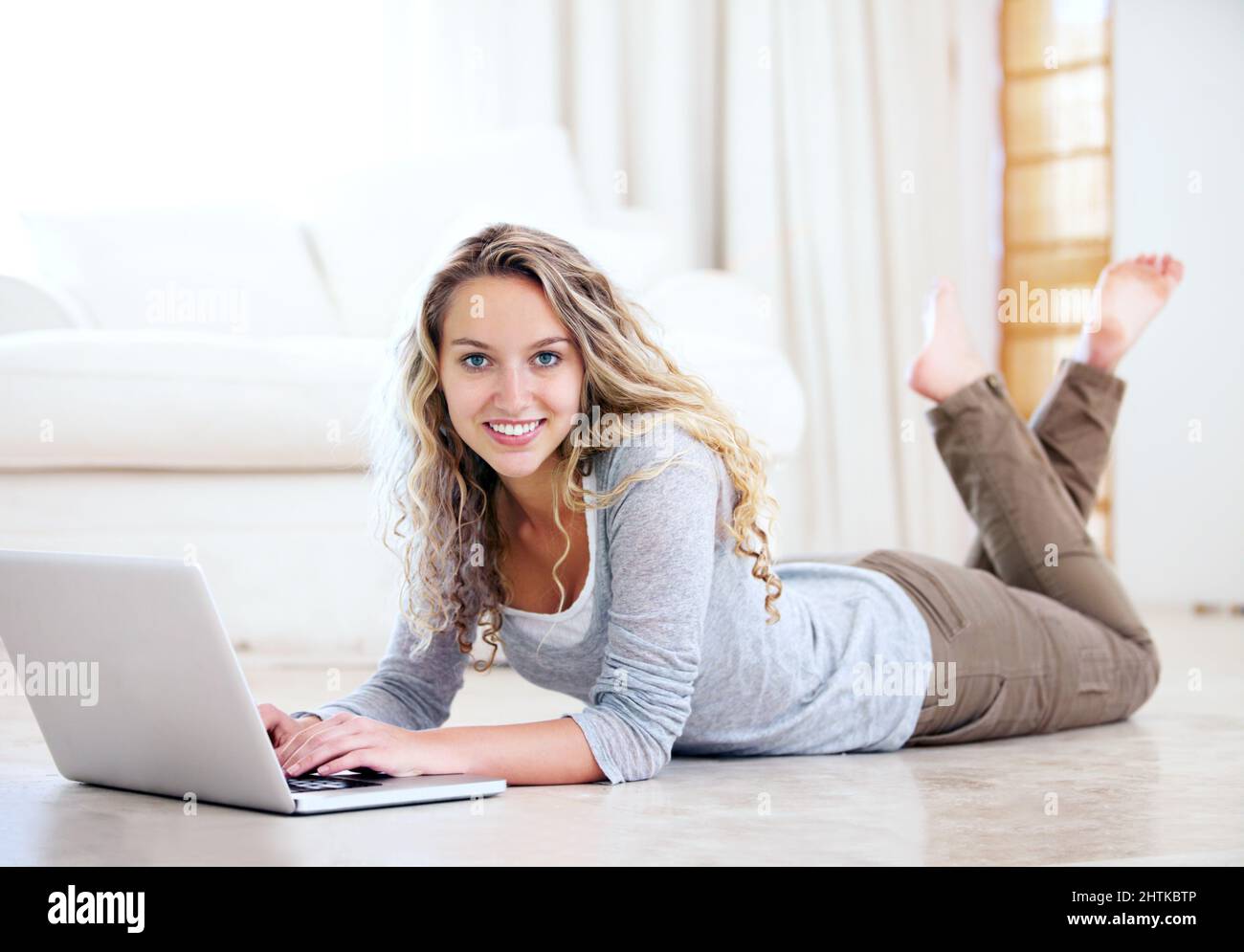 Easy, simple and fast connection. Portrait of a pretty young woman ...