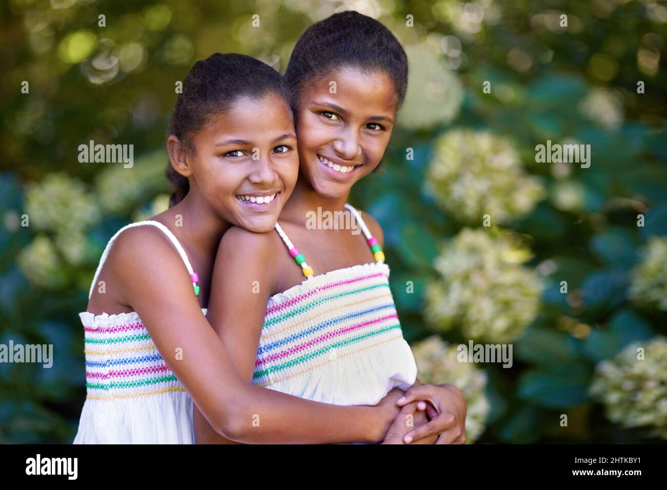 They have that special twin connection. Portrait of two twin sisters ...