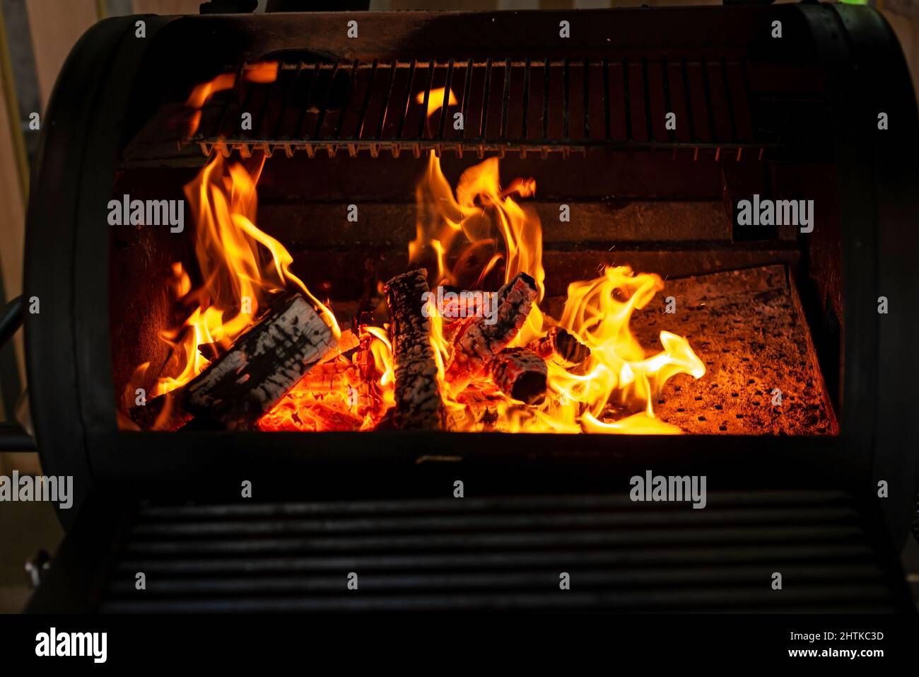 Hot empty charcoal barbecue grill with bright flame. Soft selective ...