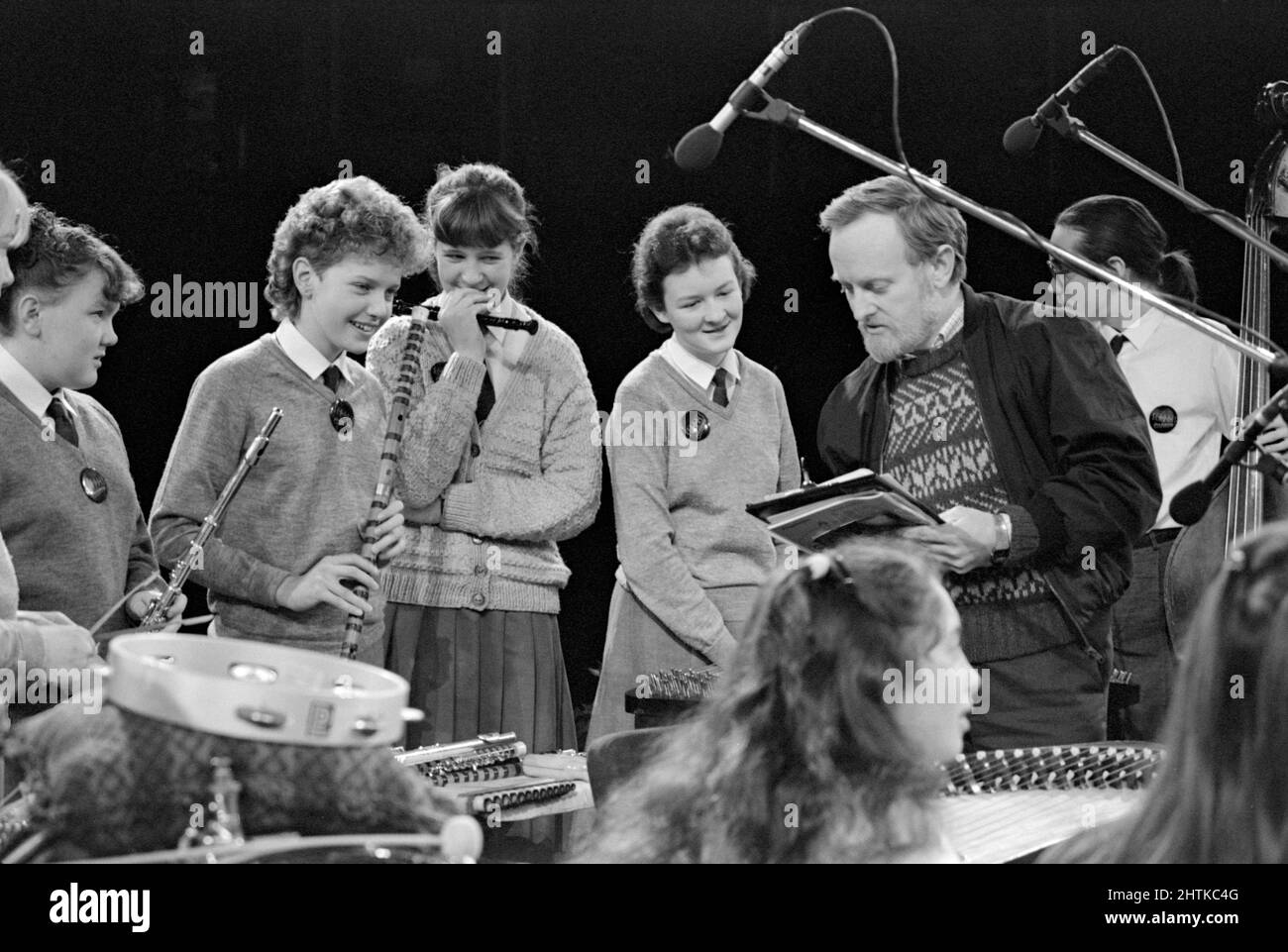 Sir Richard Stilgoe, OBE, chatting with young musicians at one of the ...