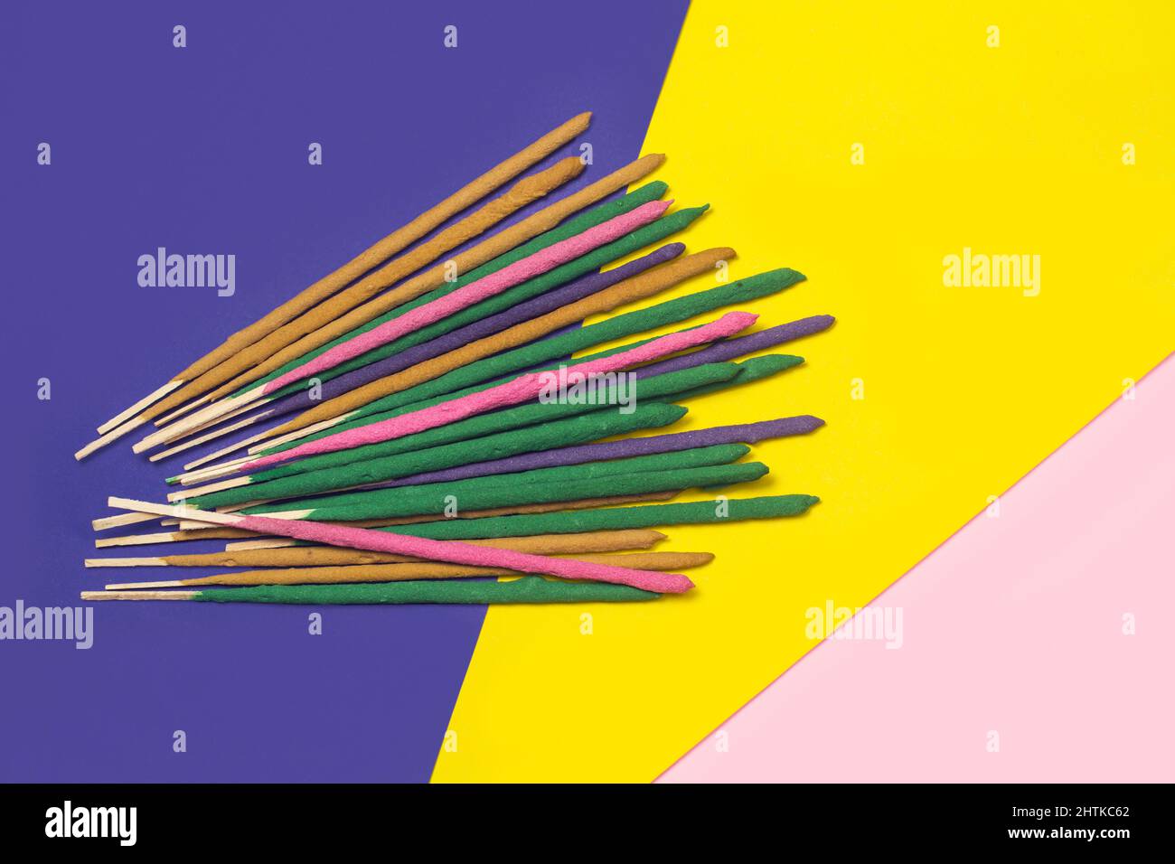 Colored incense sticks on a multicolor background in a top view Stock ...