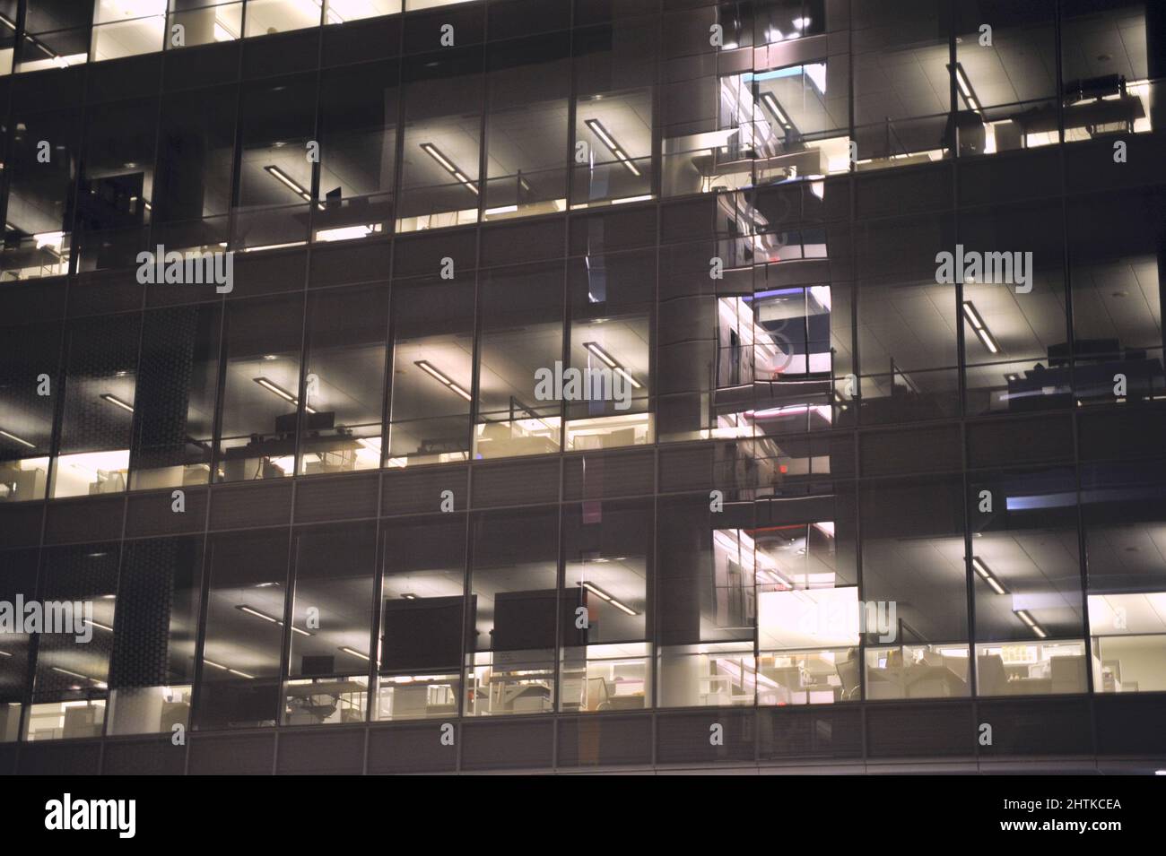 Exterior of an office building with the lights on at night Stock Photo ...