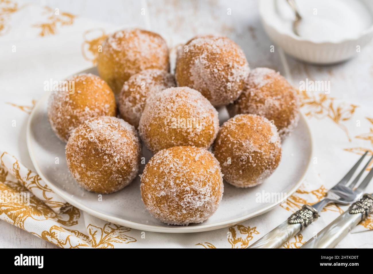 Fried curd balls with sugar on white wooden background. Concept of ...