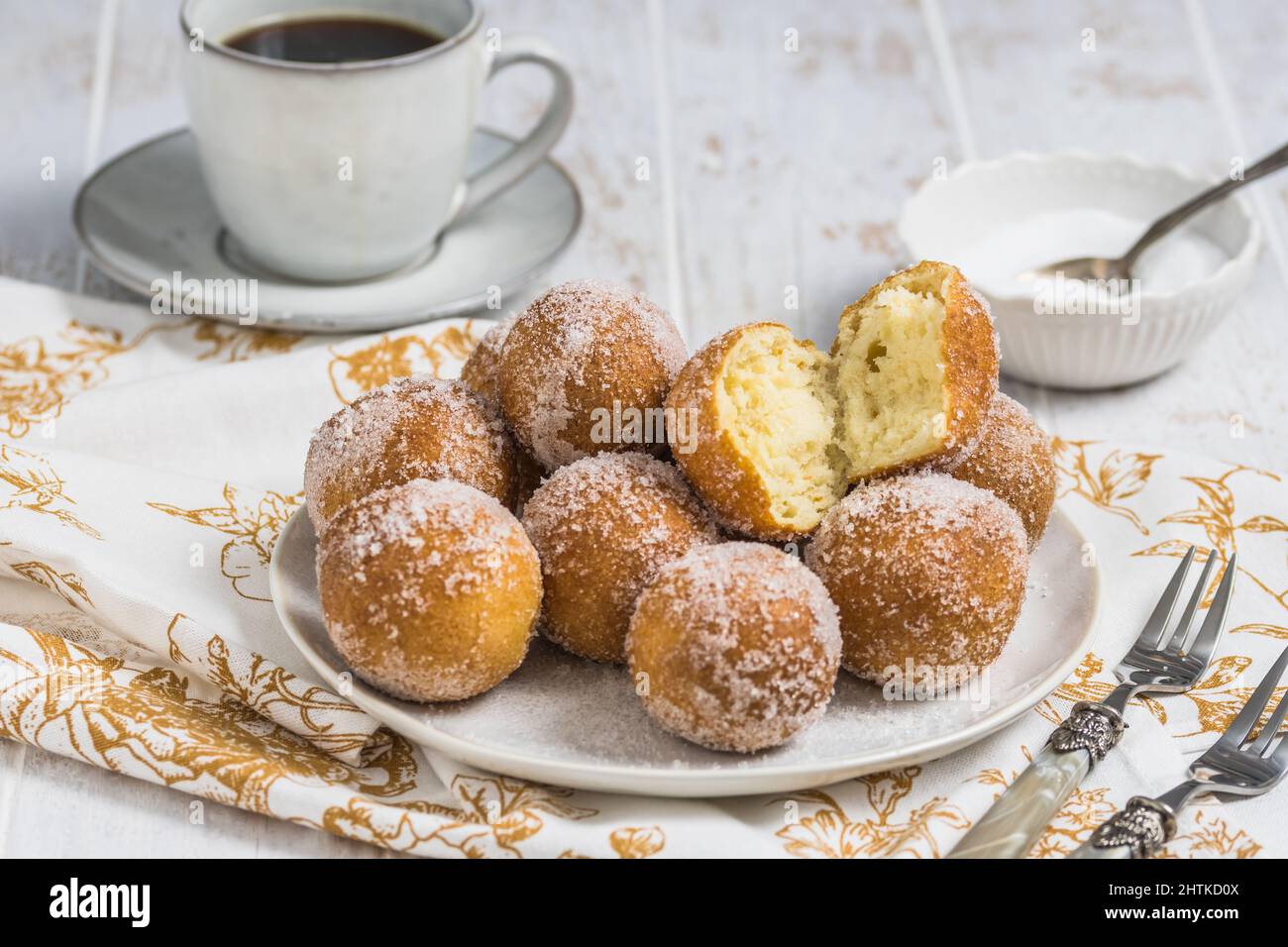 Fried curd balls with sugar on white wooden background. Concept of ...