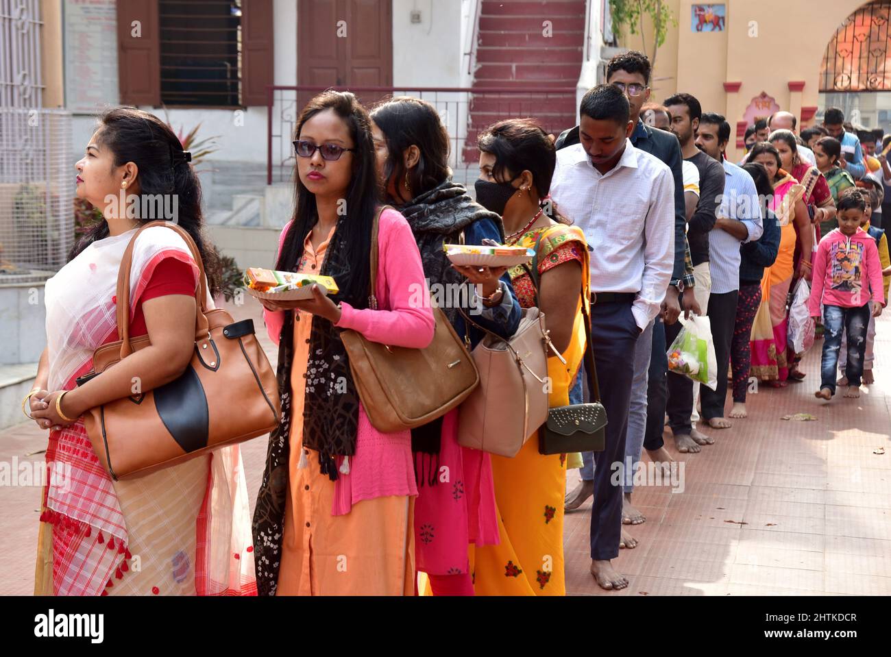 Guwahati, Guwahati, India. 1st Mar, 2022. Hindu devotees queue to offer ...
