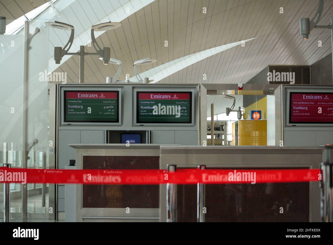 View of departure gate reception desk with Emirates Airlines logo on ...