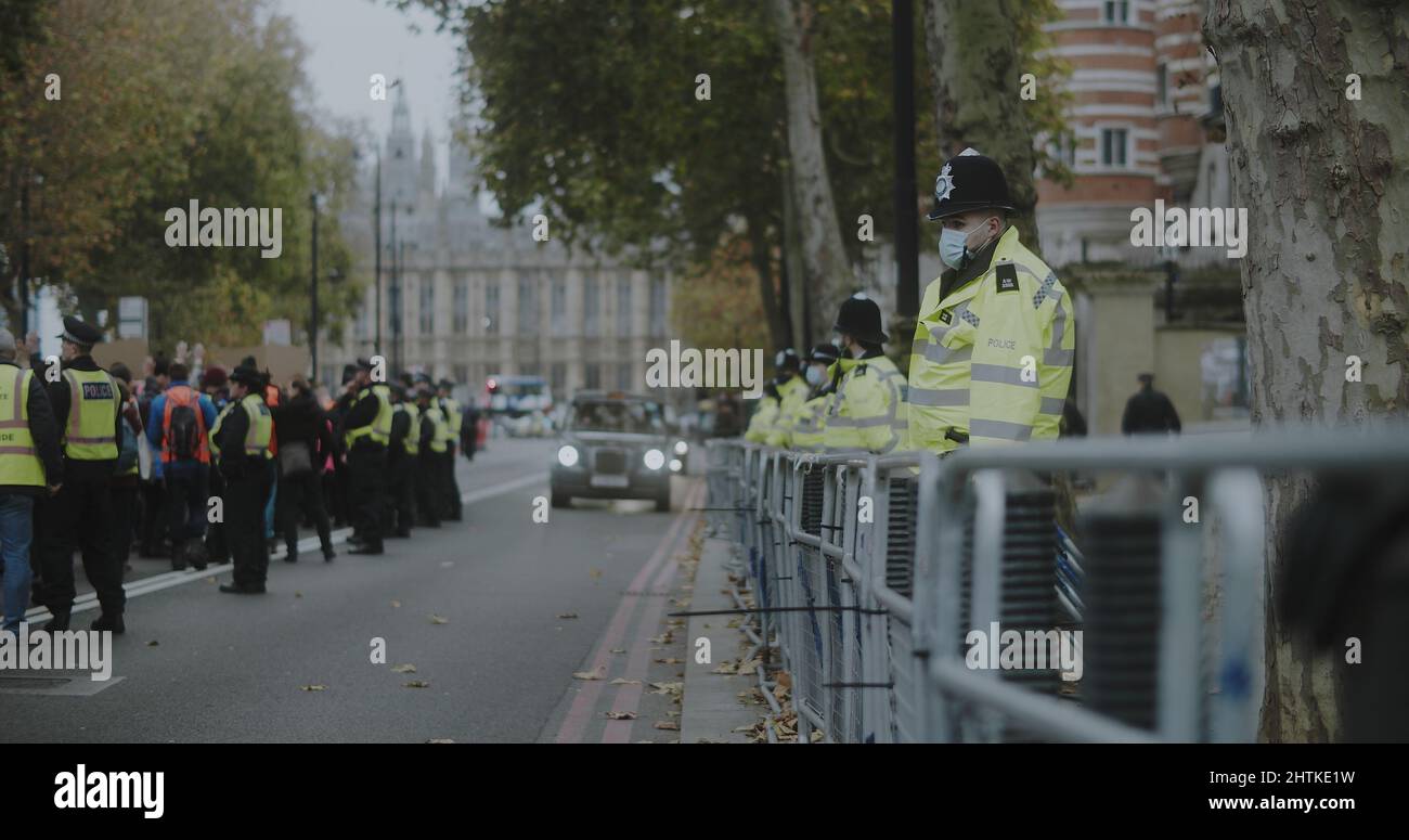 London, UK - 11 20 2021: A male metropolitan police officer wearing a ...