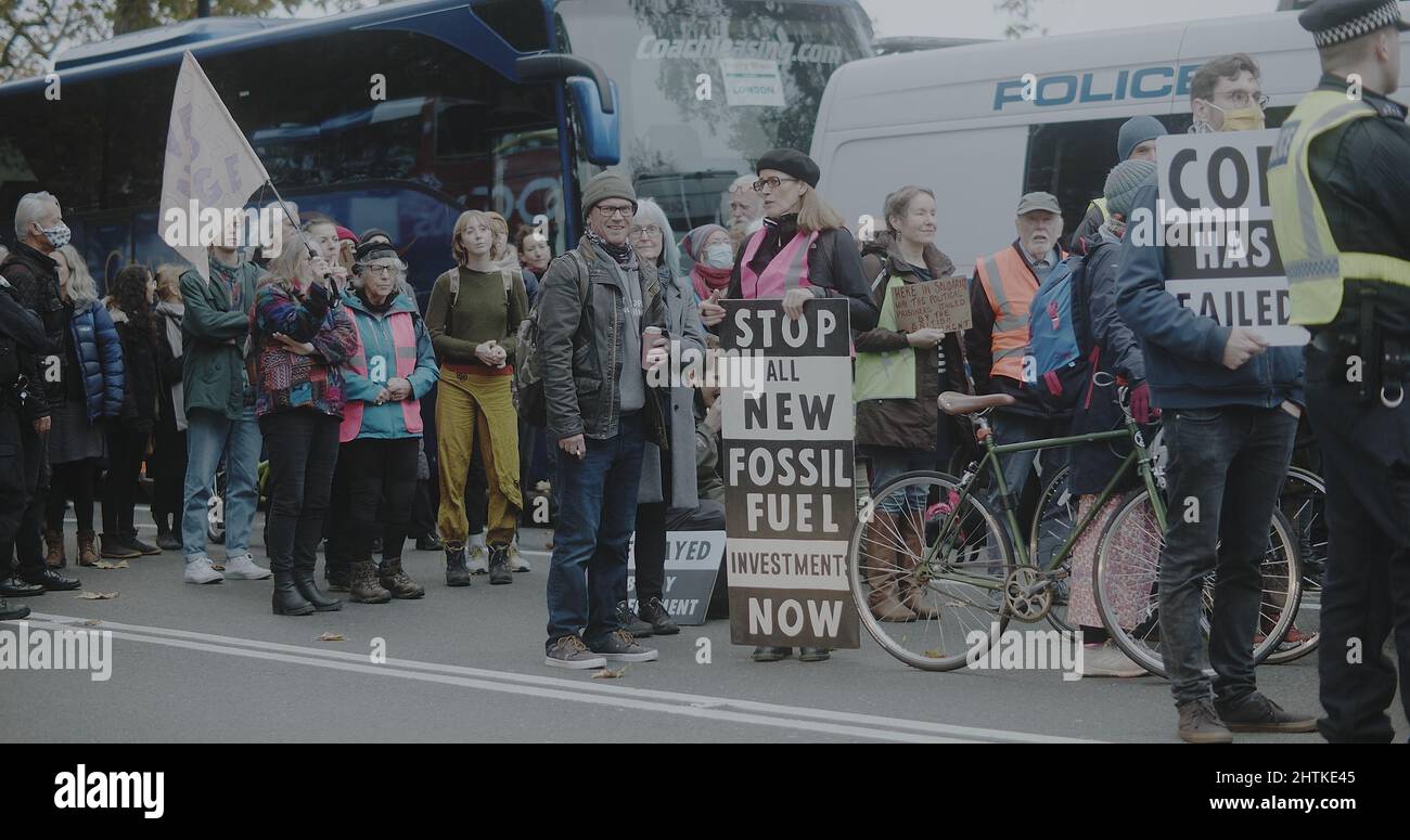 London, UK - 11 20 2021: Climate protesters holding signs, standing on ...