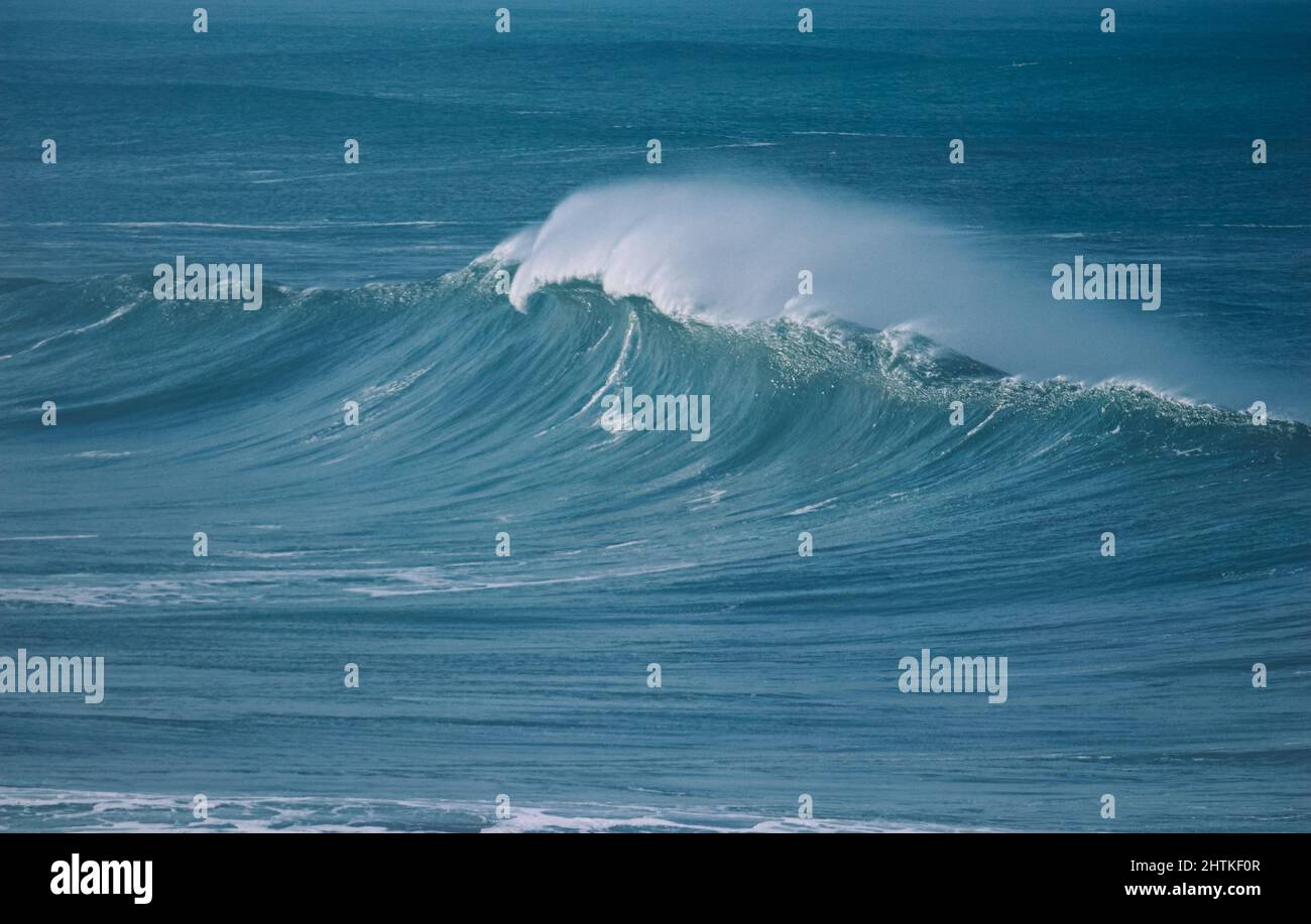 Perfect wave breaking in a beach. Surf spot Stock Photo - Alamy