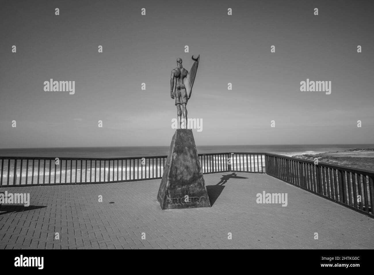 Statue of a surfer in the beach of Ribeira d’Ilhas World Surf Reserve ...