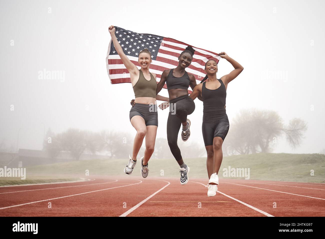 Remember to uplift your team members. Shot of a young sports team ...