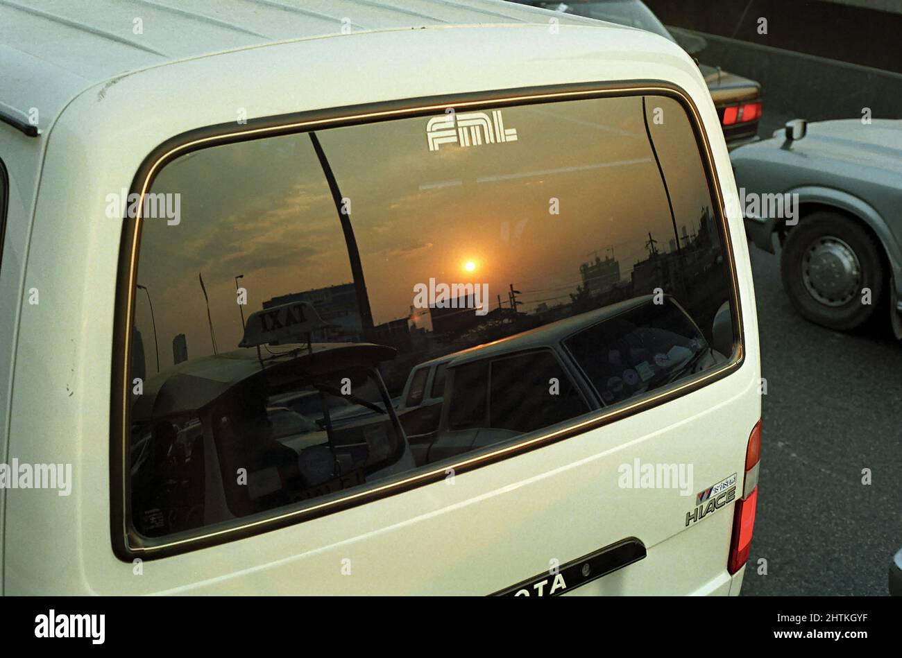 Sunset reflected in a car window in a traffic-jam, Bangkok,Thailand ...