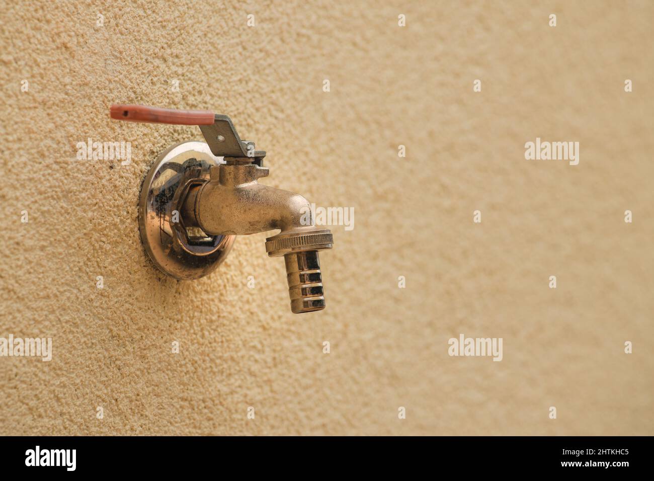 Outdoor faucet or hose bib with copy space Stock Photo - Alamy