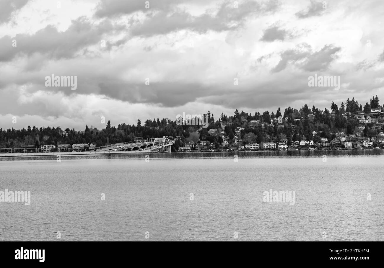 Clouds hover over a bridge on Lake Washington in Seattle Stock Photo ...