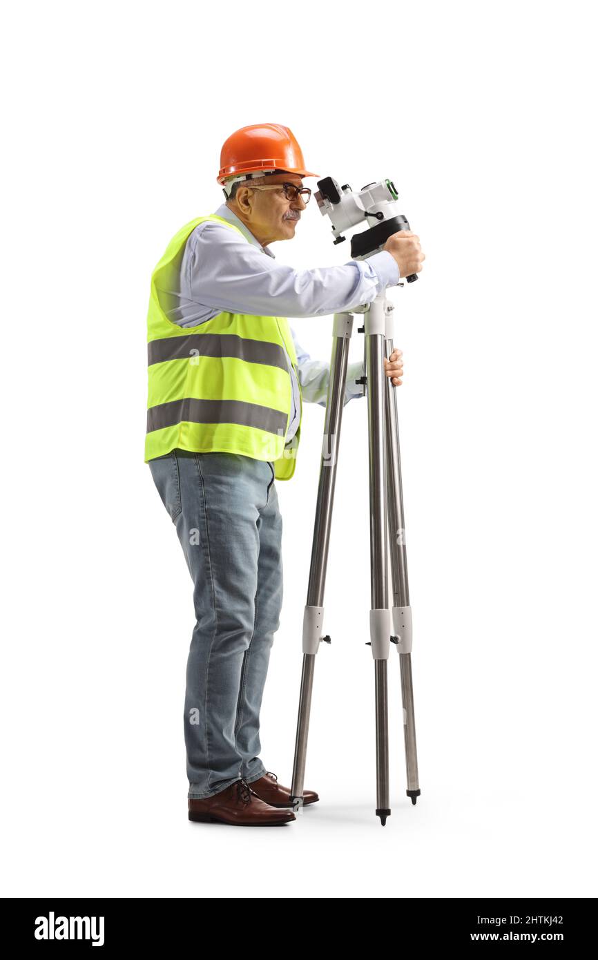 Full length profile shot of a mature geodetic surveyor measuring with a ...