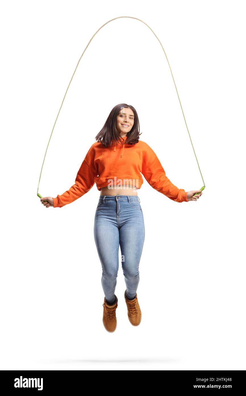Trendy young female skipping a rope isolated on white background Stock ...