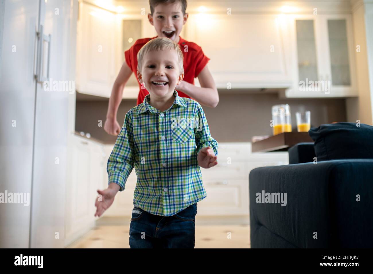 Children running around inside hi-res stock photography and images - Alamy