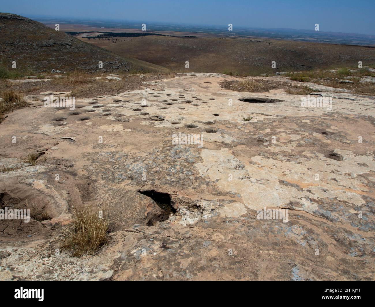 Gobekli Tepe is an archaeological site at the top of a mountain ridge ...