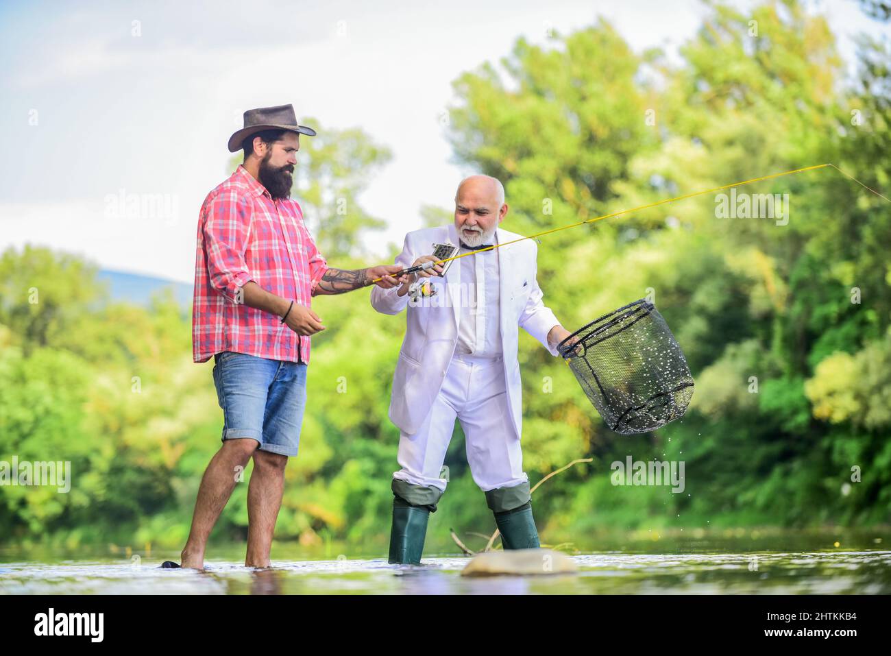 Angler netting fish hi-res stock photography and images - Alamy