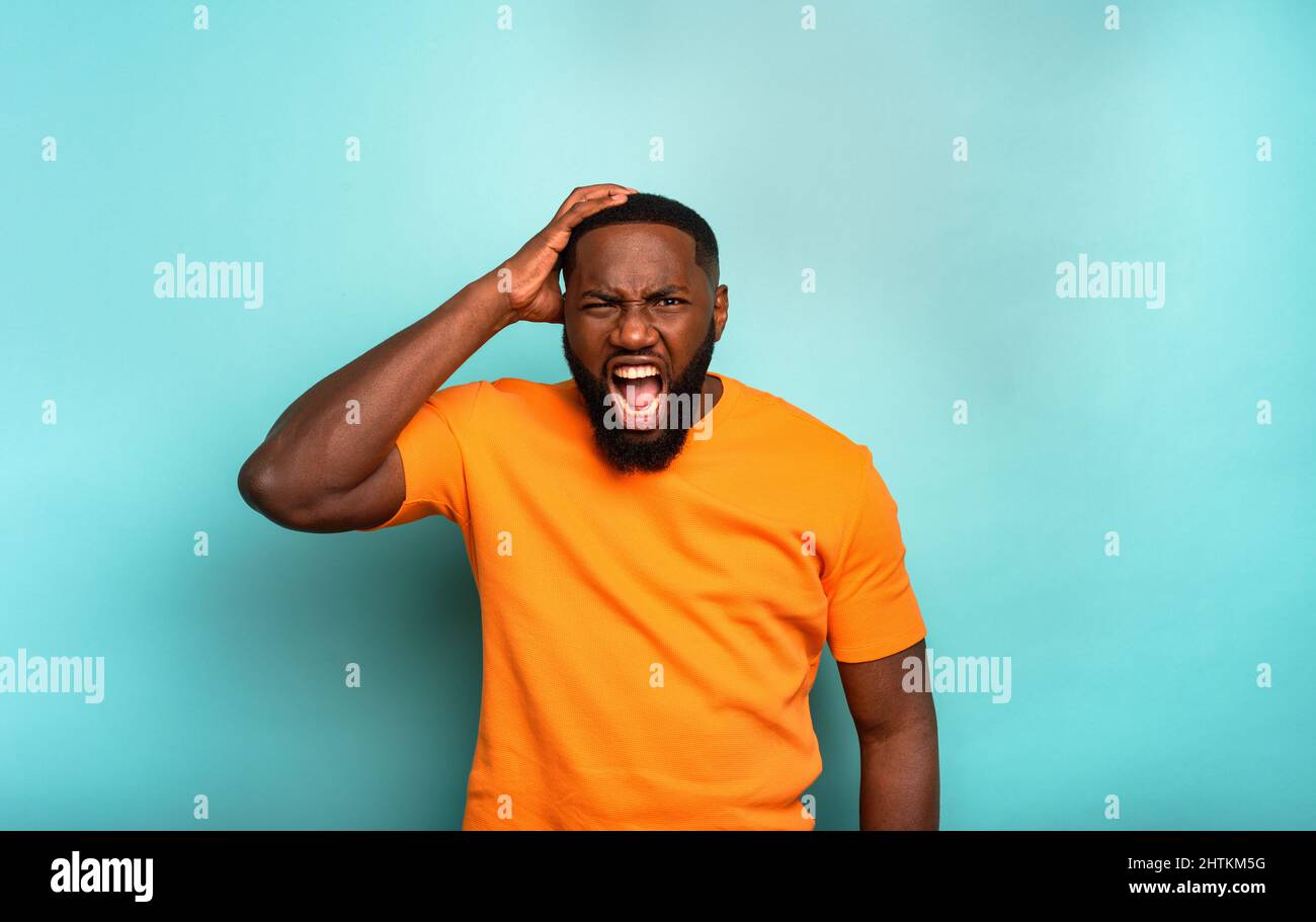 Man with stressed and exhausted expression is desperate Stock Photo - Alamy