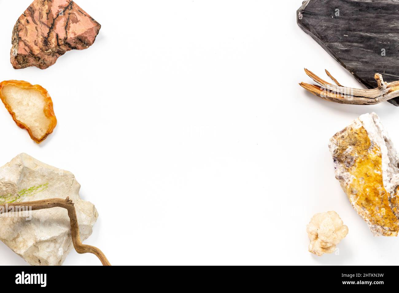 Frame of natural mineral rocks with snag tree branch Stock Photo - Alamy